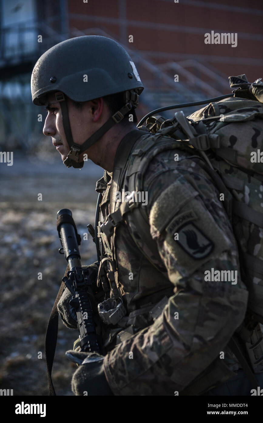 Sgt Angel Gomez crosses the finish line after the 12 mile ruck march ...