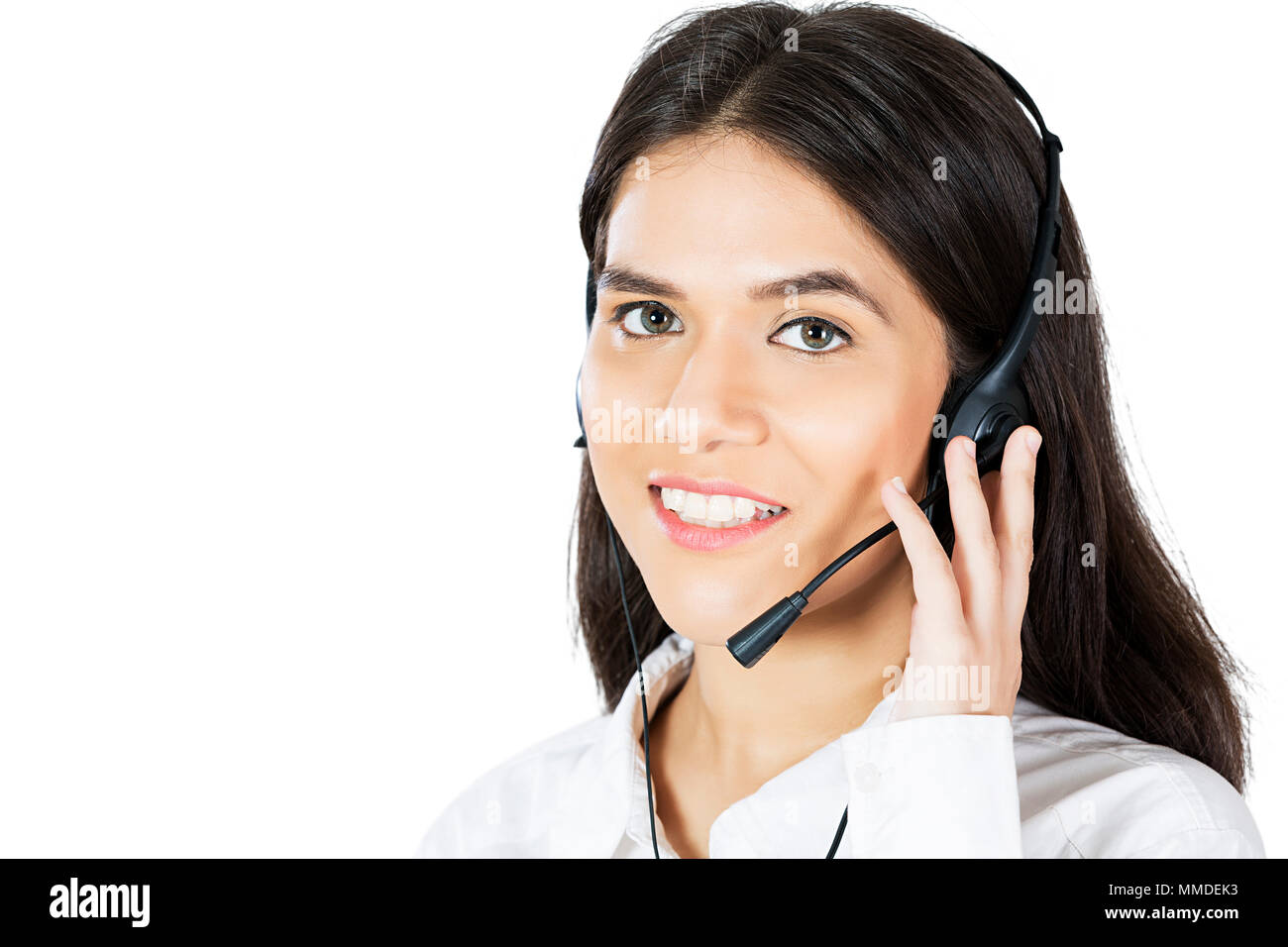 Close-up Smiling young call center employee smiling with a headset ...