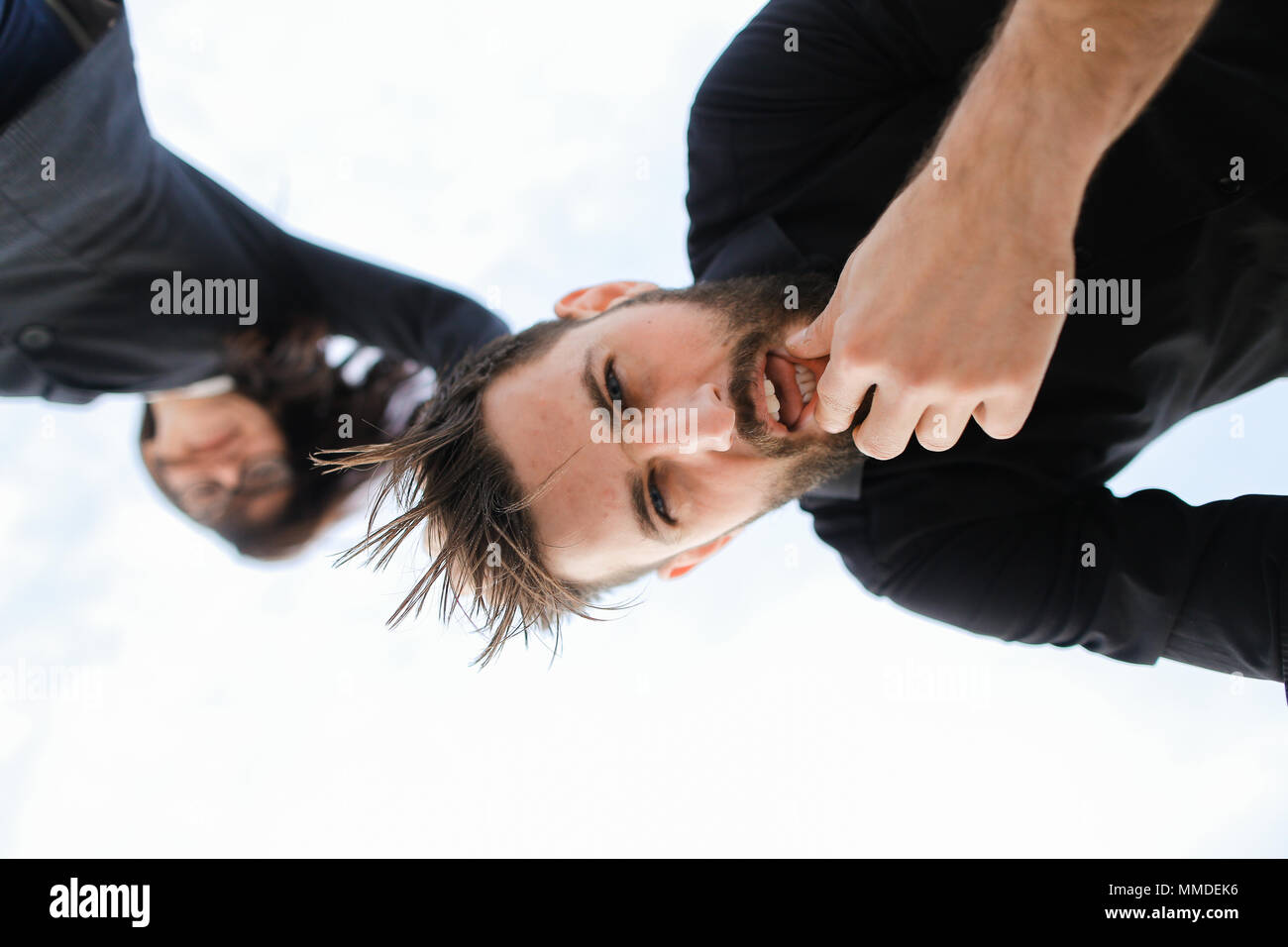 Photo from below, american young man and woman wearing black clothes in ...
