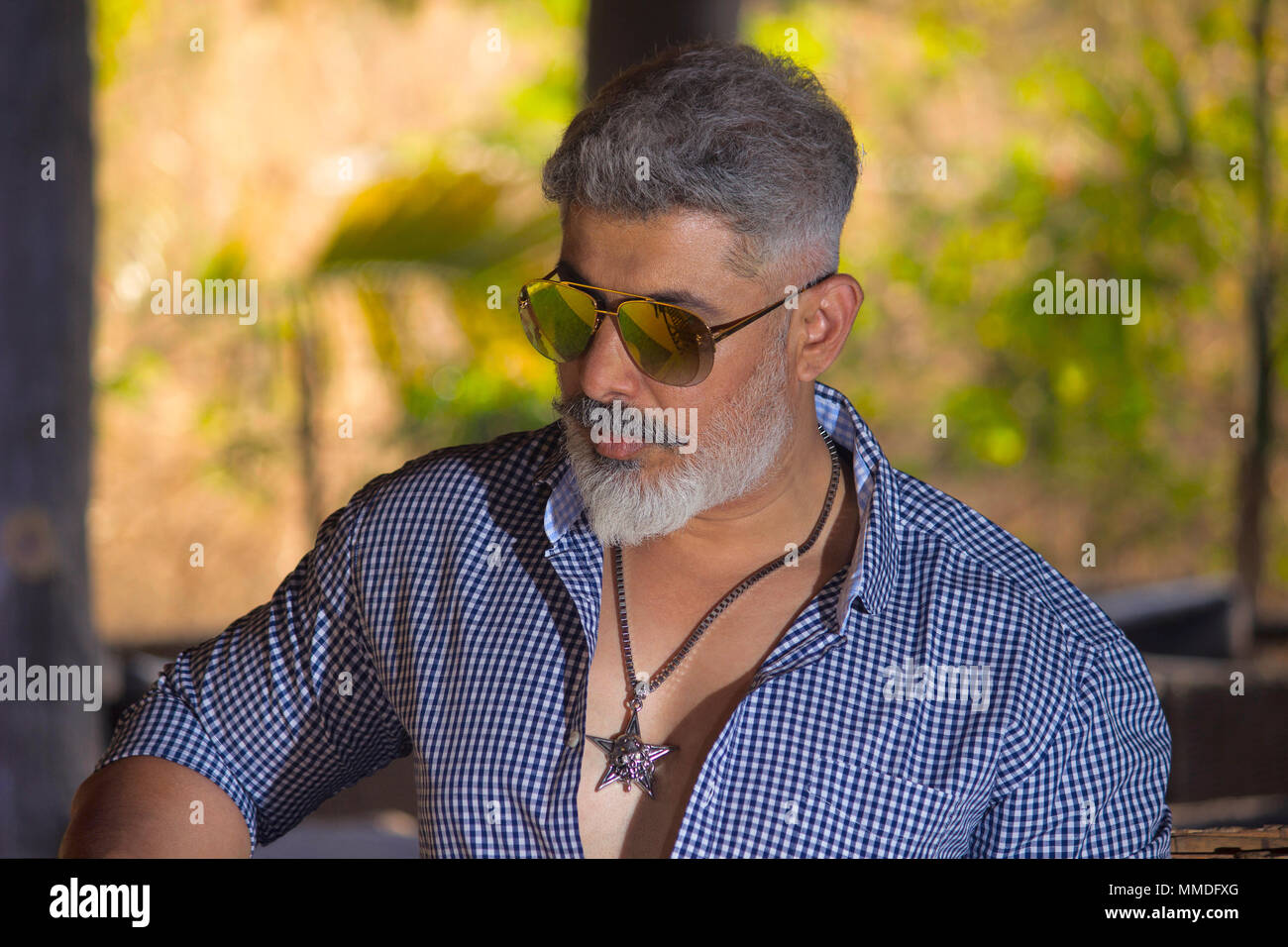 Man with grey hair grey beard in smart casuals looking at camera Stock ...