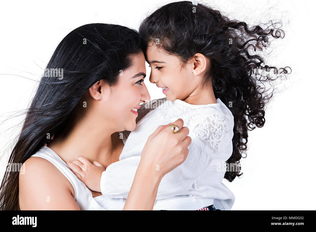 Happy Mother and Kid daughter touching with foreheads and looking-at ...