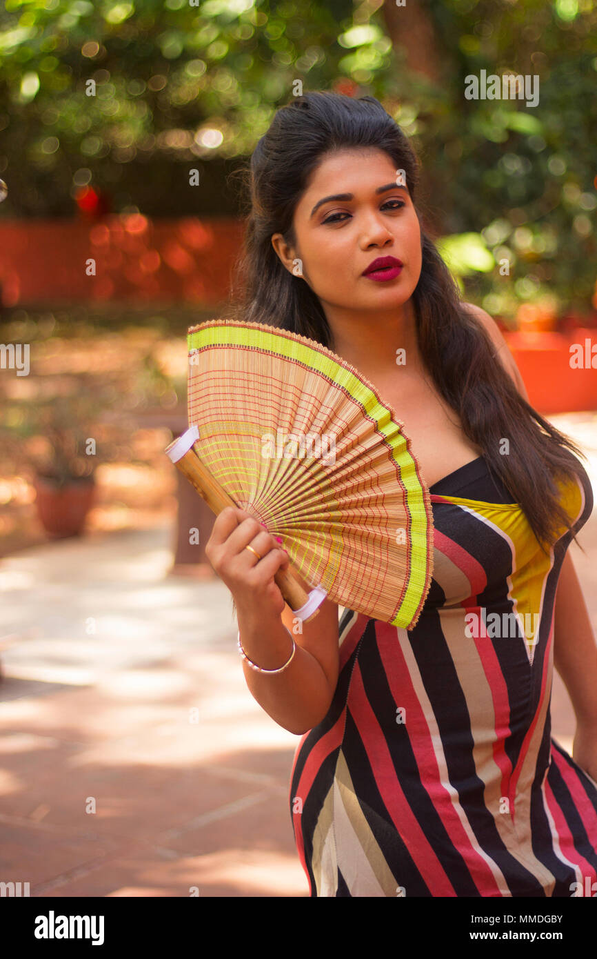 Indian hand holding fan indian hi-res stock photography and images - Alamy