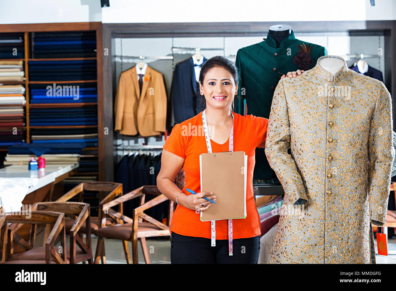 One Female Boutique Tailor Fashion Designer Working In-Clothes Shop ...
