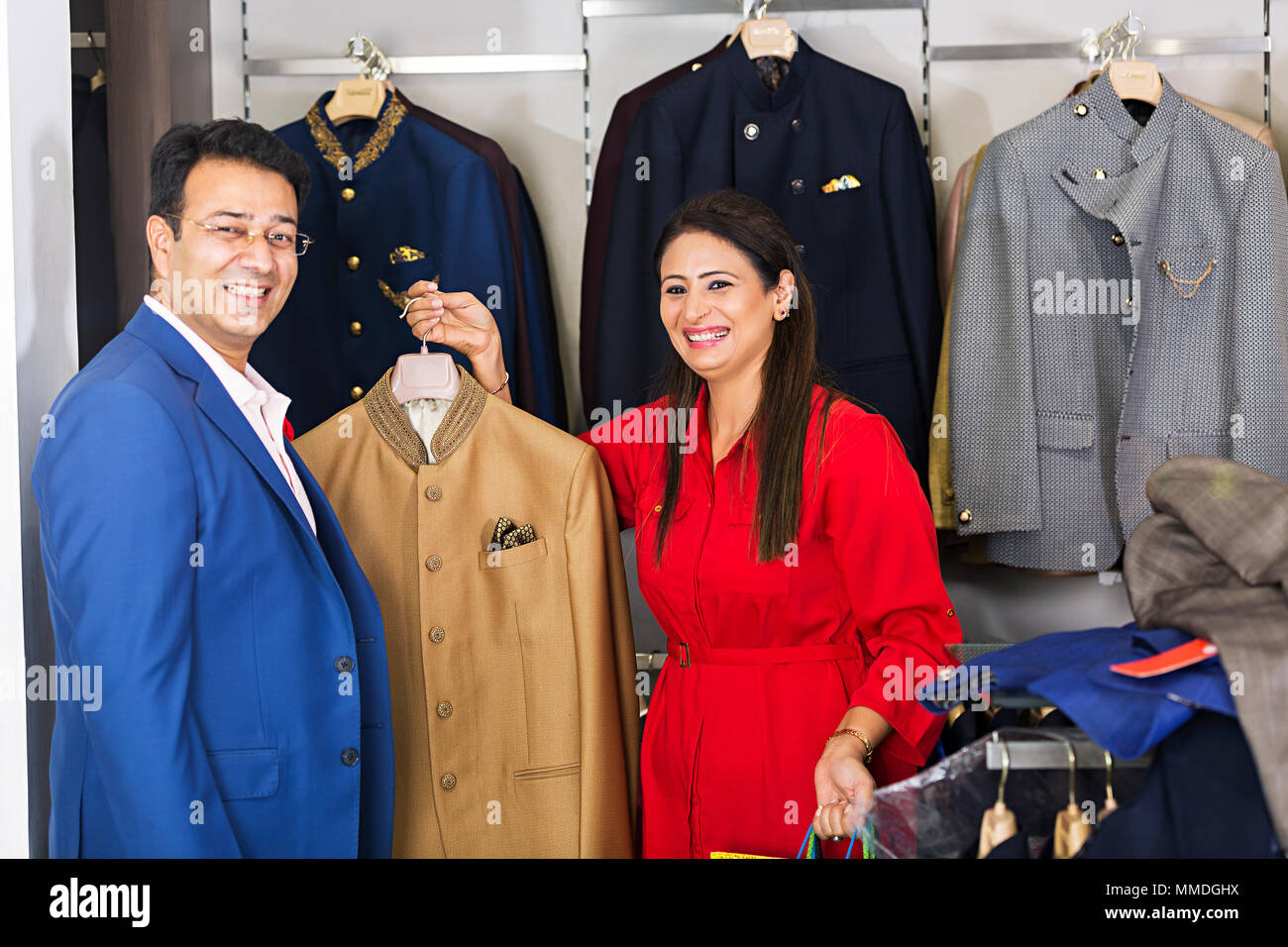 Married Couple shopping in clothes-shop, Wife Holding Coat Check Buy ...