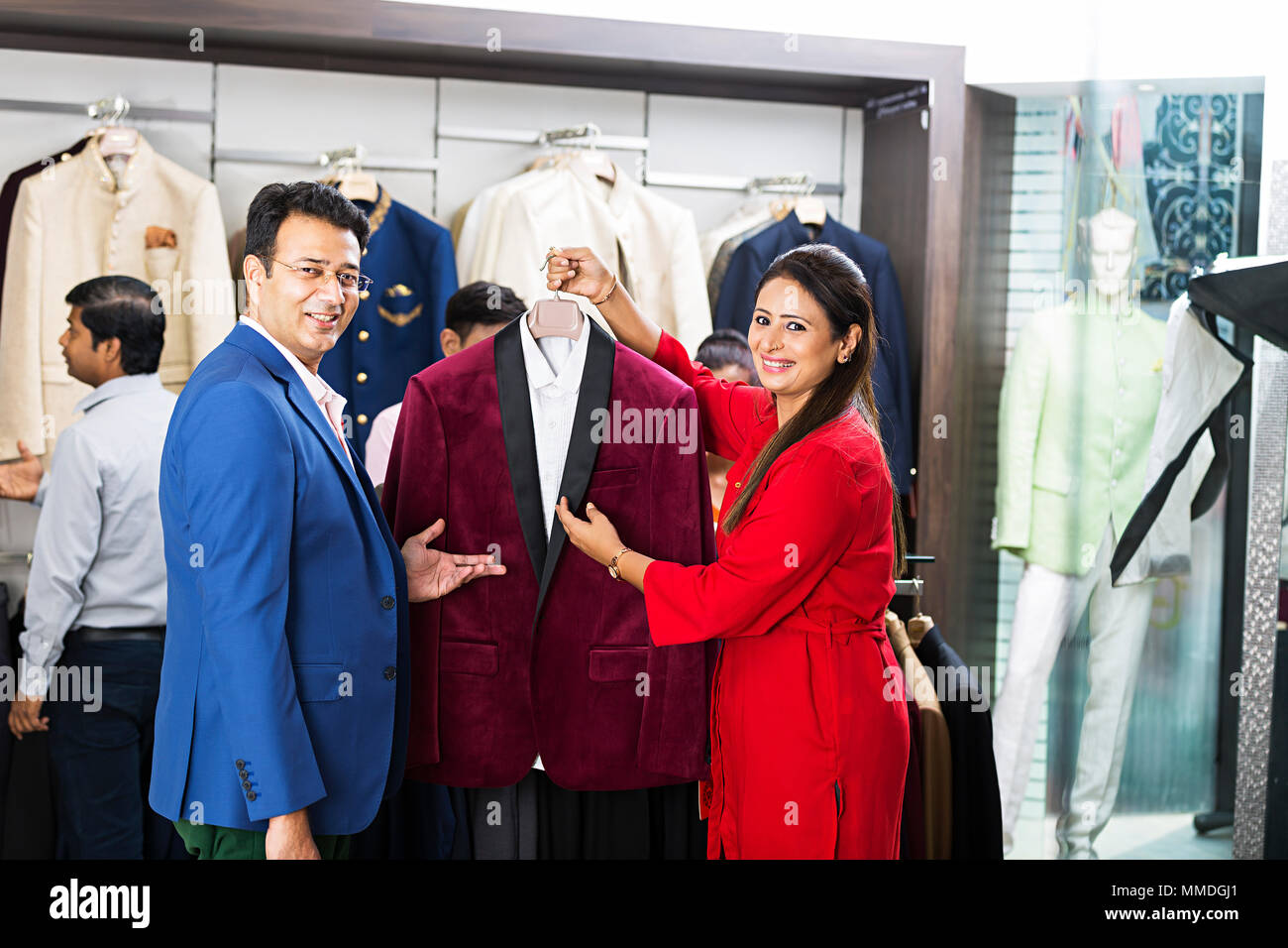 Happy Couple Choice Checking Coat Hand Gesturing Showing In-Clothes ...