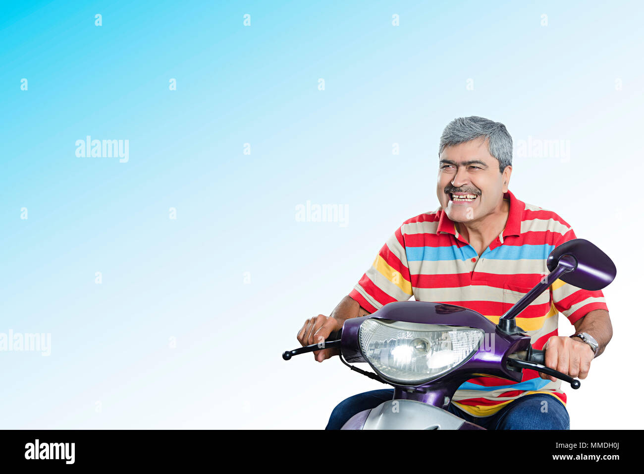 Indian man riding a scooter hi-res stock photography and images - Alamy