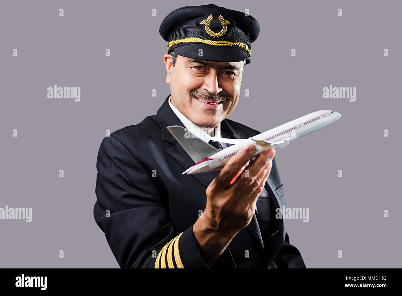 Indian man holding hand to side hi-res stock photography and images - Alamy