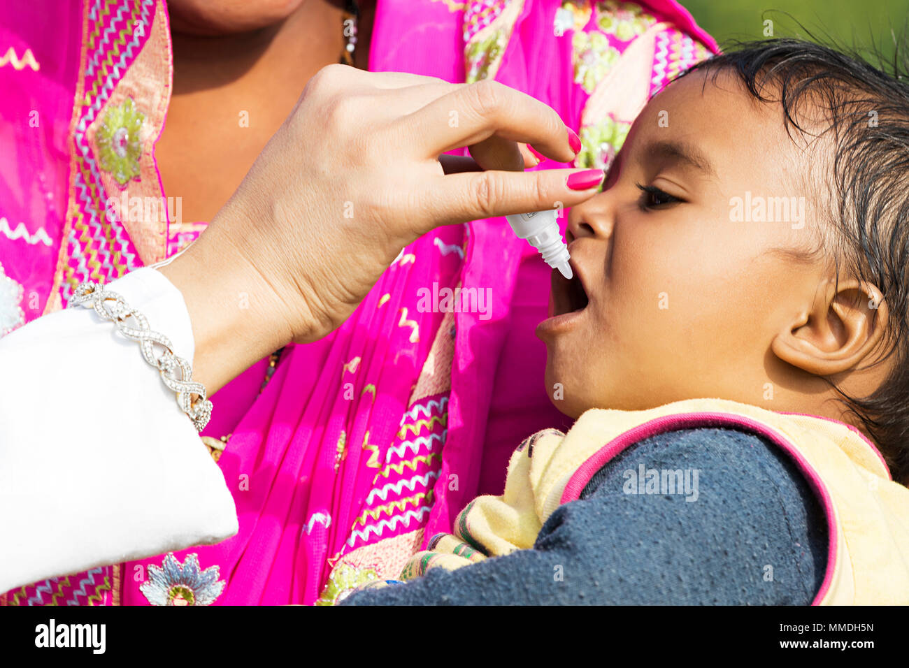 Medical Doctor Polio Drop Medicine Baby With Mother Rural Village Stock ...
