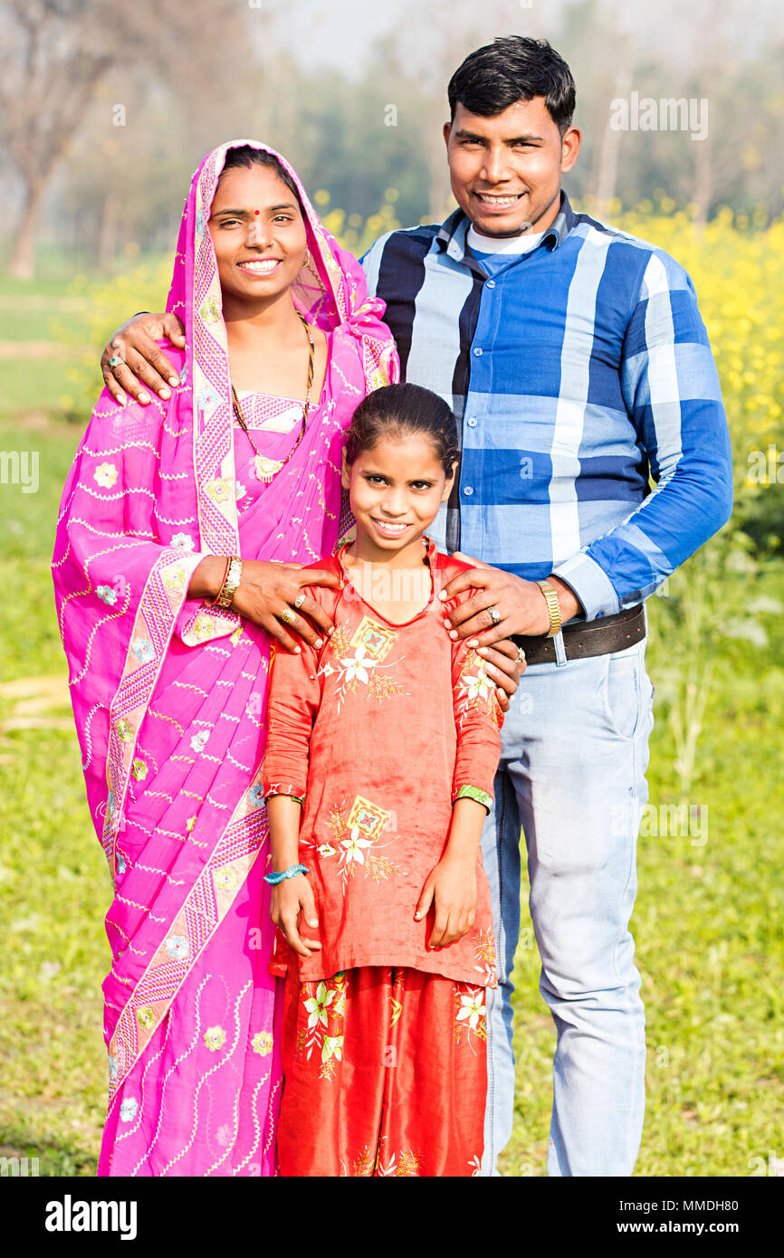 Rural Farmer Family- Parents And Daughter Standing Together Field Stock ...