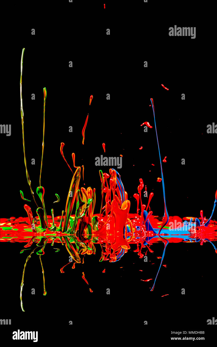 Abstract color splash on black background Stock Photo - Alamy