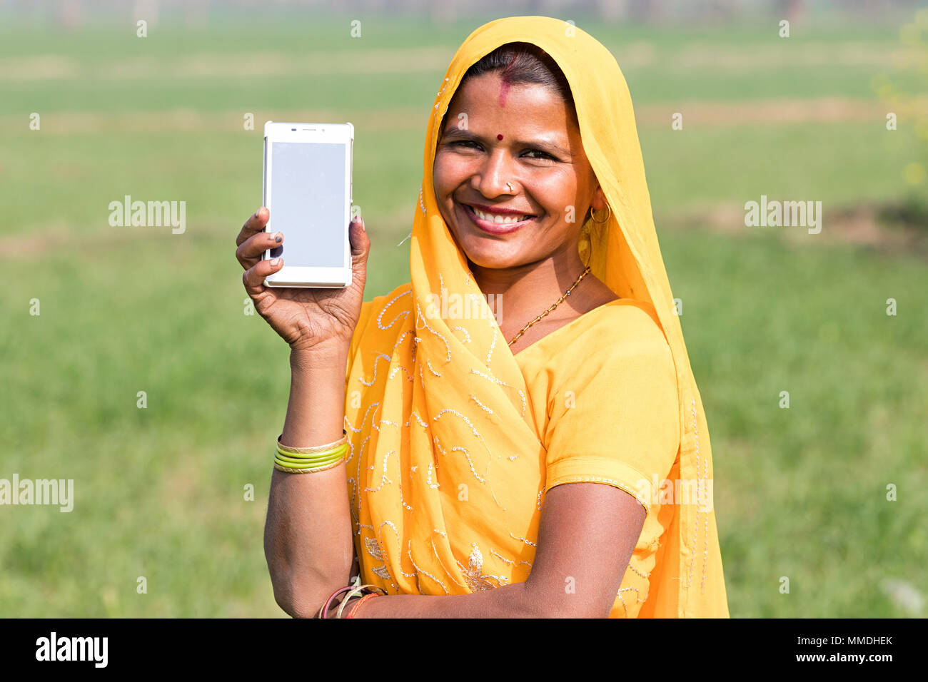 Village looking at smartphone hi-res stock photography and images - Alamy
