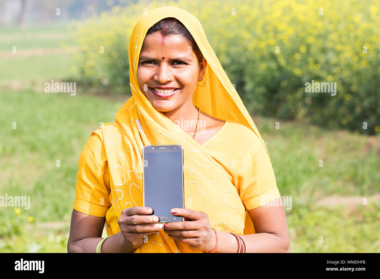 Indian villager smartphone hi-res stock photography and images - Alamy