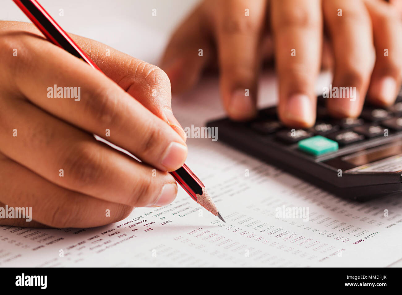 Calculating with calculator hi-res stock photography and images - Alamy