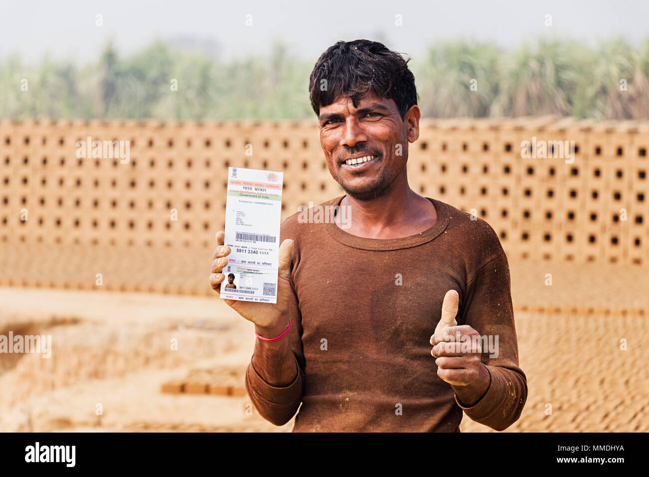 Rural Labour Male Showing Thumbs-up With Aadhaar-Card Government -Id In ...