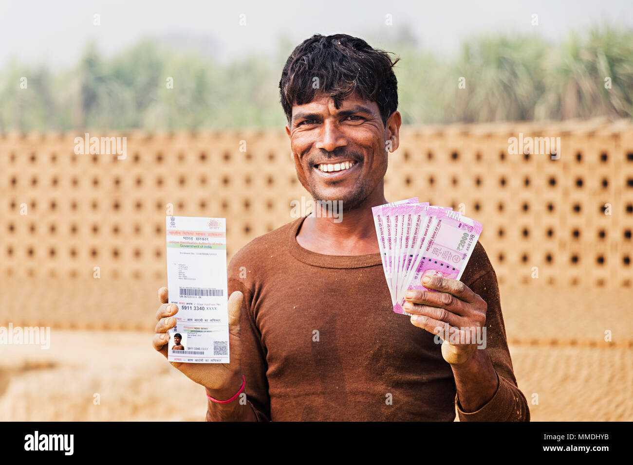 One Labour Male Showing Money With Aadhaar-Card In Village Brick ...