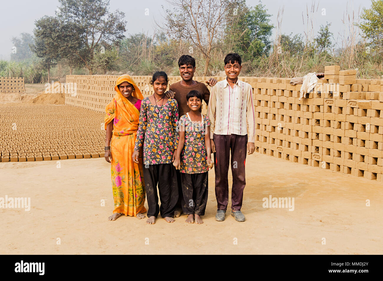 Rural Factory Worker Family. Parents And Kids Together In Brick-Factory ...