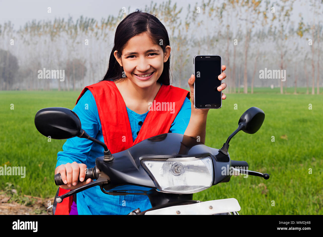 Indian girl scooty hi-res stock photography and images - Alamy