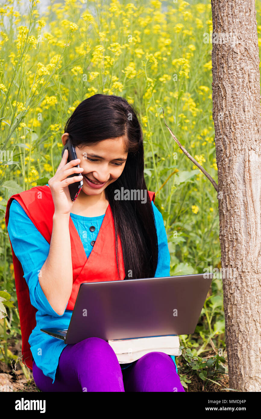Rural Villager College Girl Laptop Working And Talking Smartphone In ...