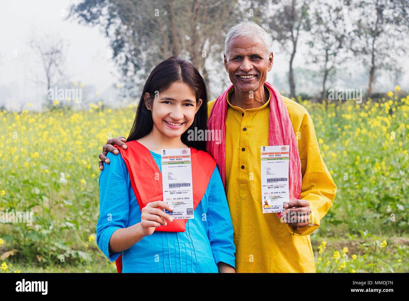 Rural Villager, father And daughter Showing Aadhaar-Card Government -Id ...