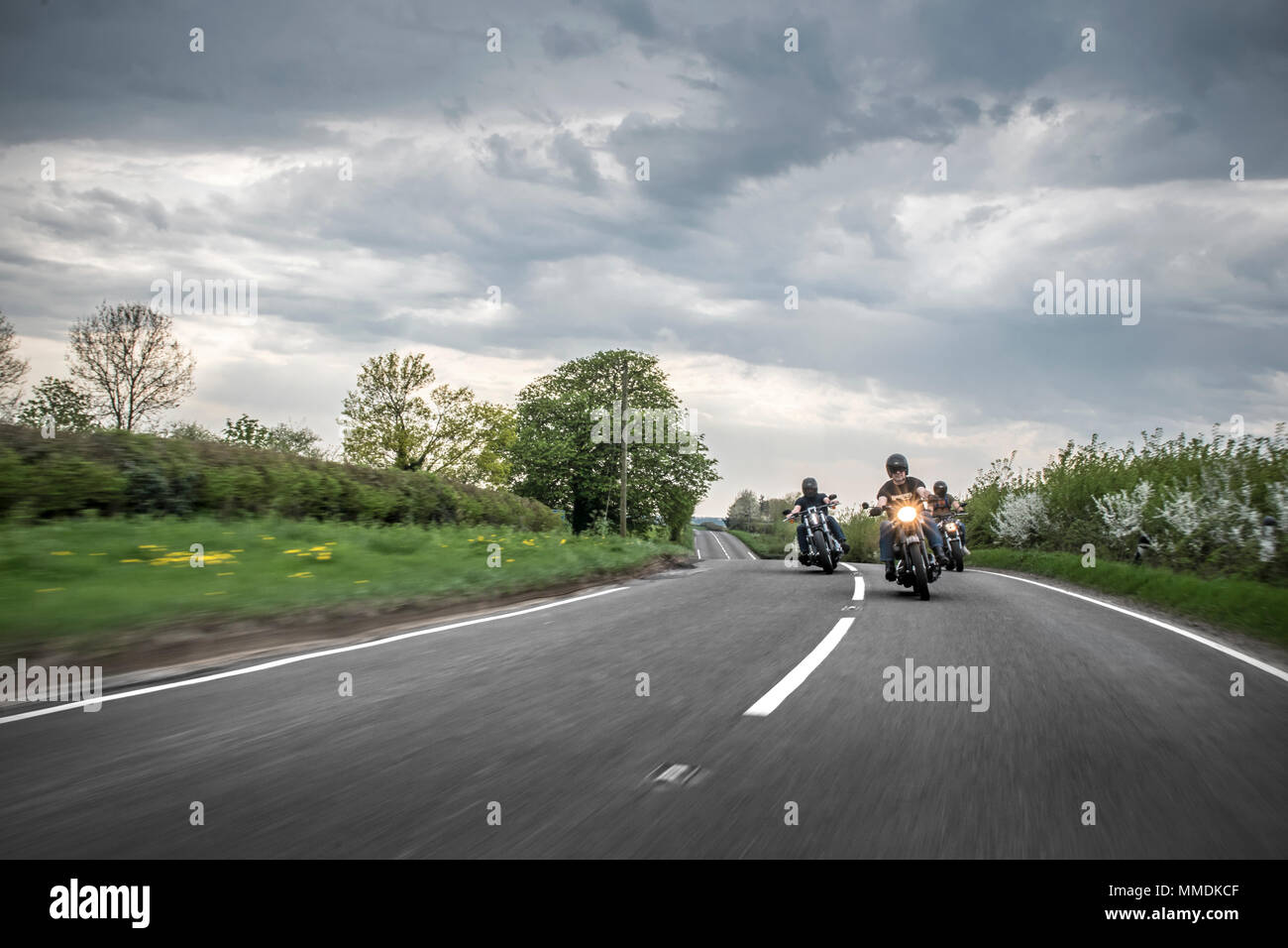 Bikers riding on the road. Motorcycle club out for a ride in England ...
