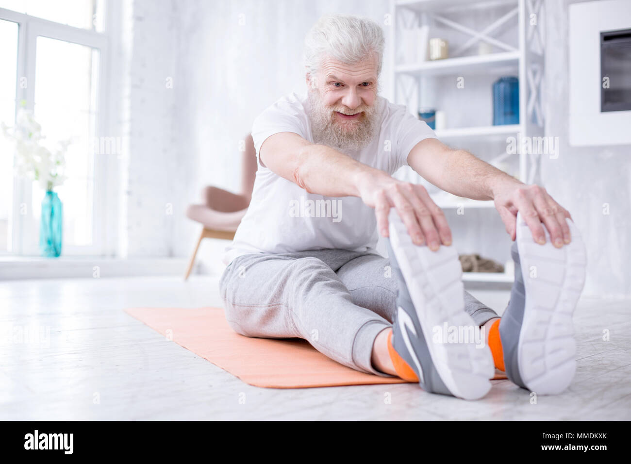 Man touching toes hi-res stock photography and images - Alamy