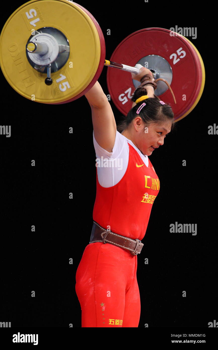 Yue Kang of China competes in the Women's 69kg weight lifting program ...