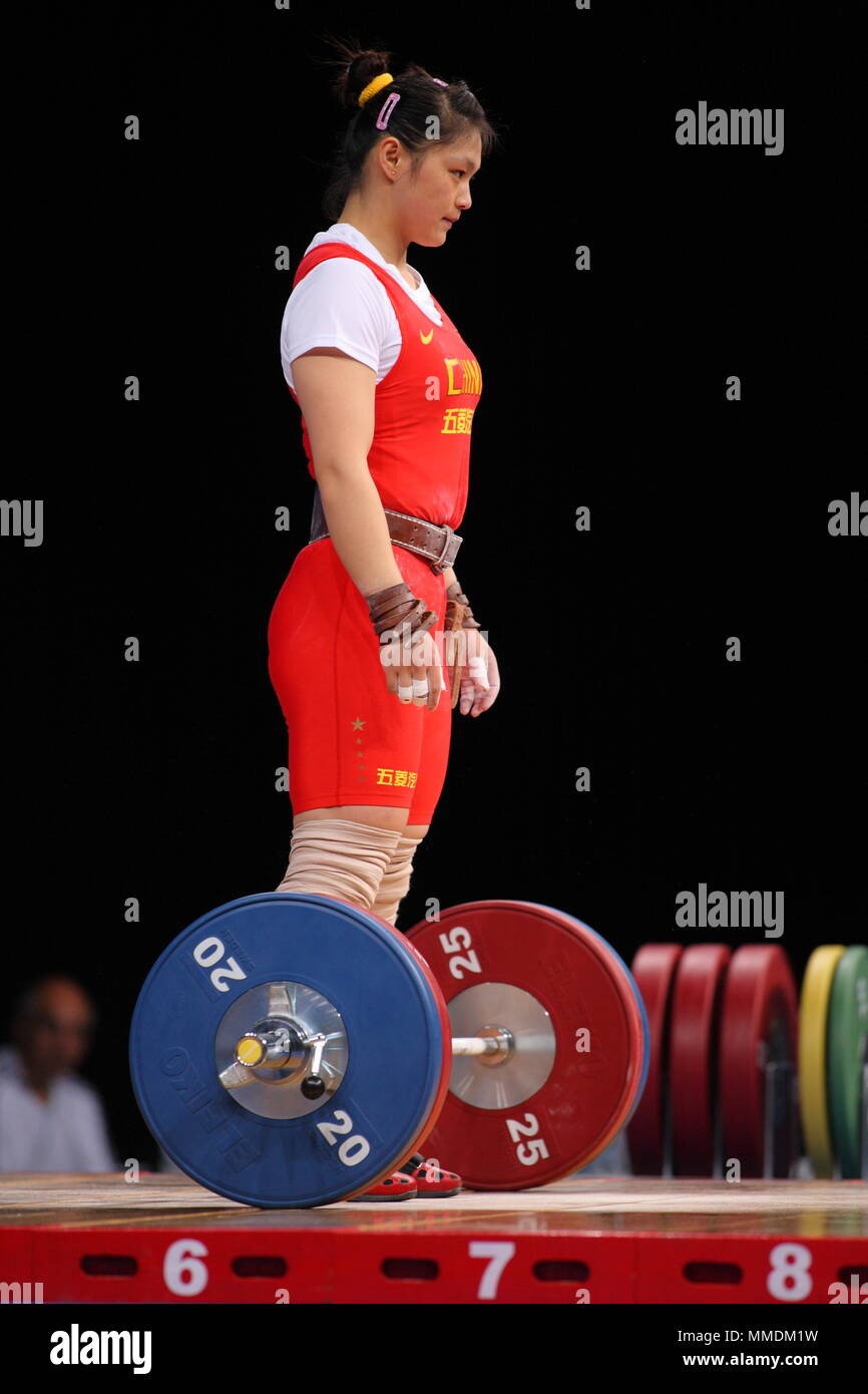 Yue Kang of China competes in the Women's 69kg weight lifting program ...