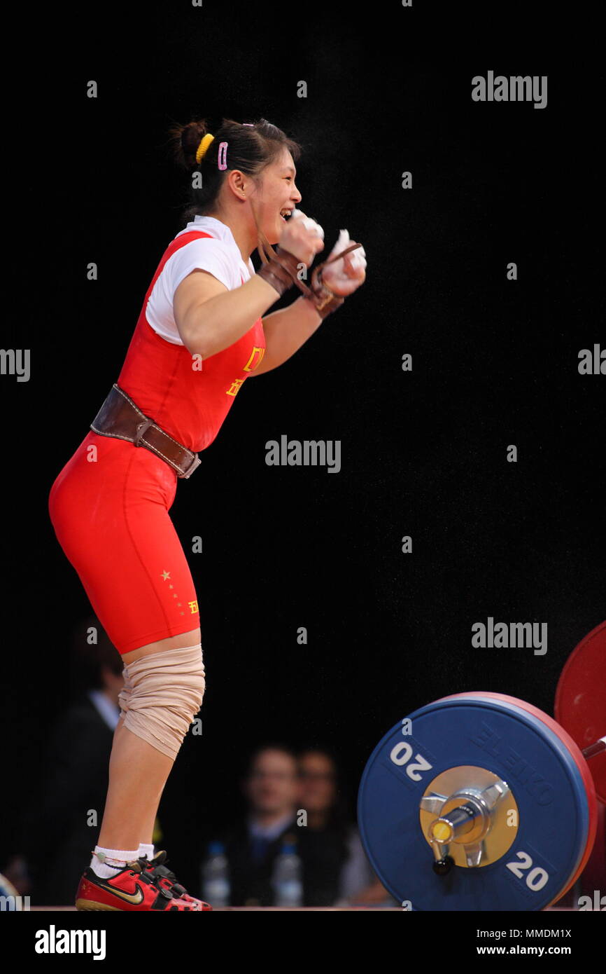 Yue Kang of China competes in the Women's 69kg weight lifting program ...