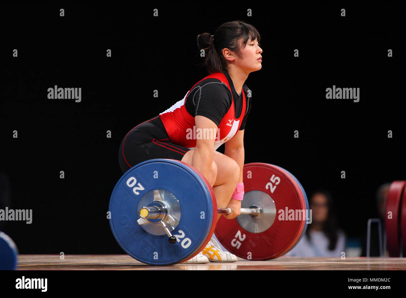 Ayano Tani of Japan competes in the Women's 69kg weight lifting program ...