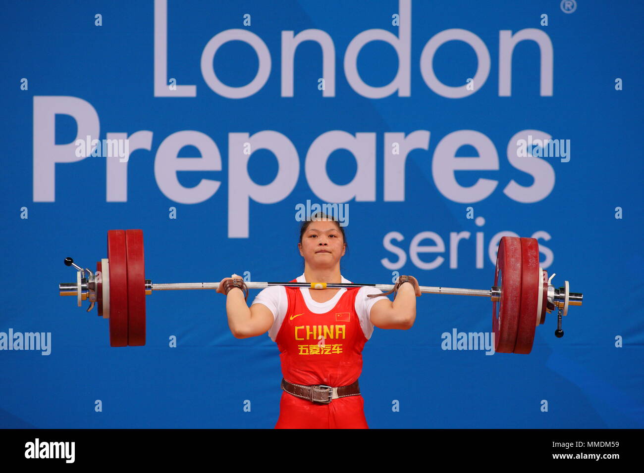 Yue Kang of China competes in the Women's 69kg weight lifting program ...