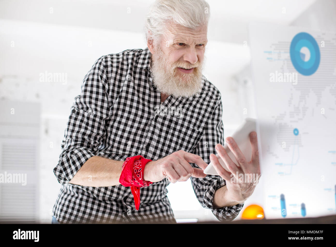 White-haired senior man checking data from screen Stock Photo - Alamy