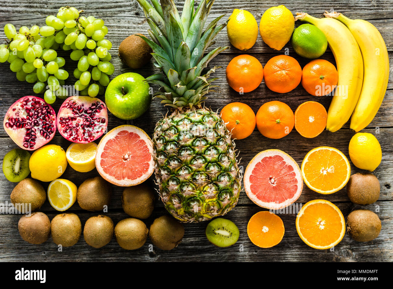 Table with fruit, tropical variety of assorted fruits on wood, healthy ...