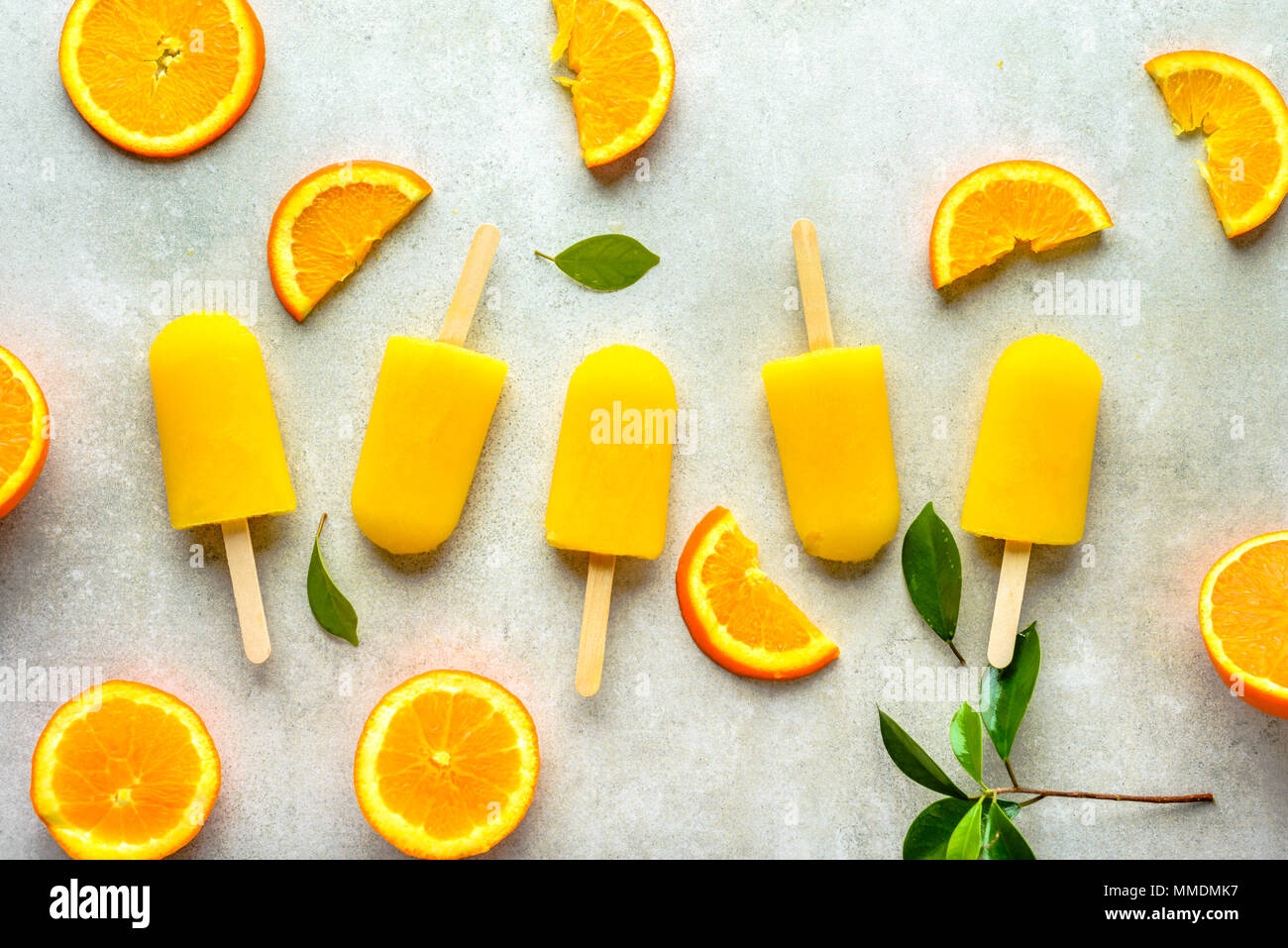 Orange popsicles with juice. Ice pops, flat lay, top view Stock Photo ...