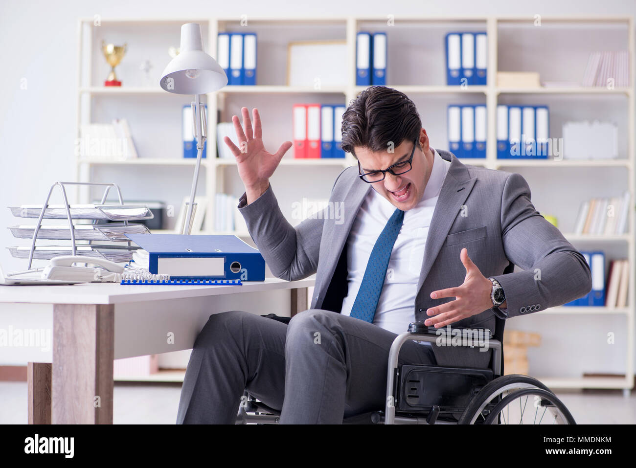 Disabled businessman working in the office Stock Photo - Alamy