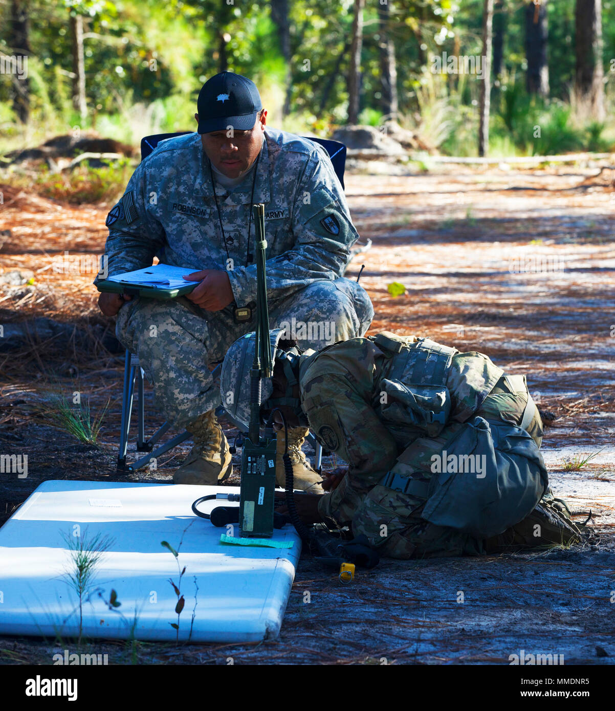 U.S. Army soldier puts together a radio during the Expert Field Medical ...