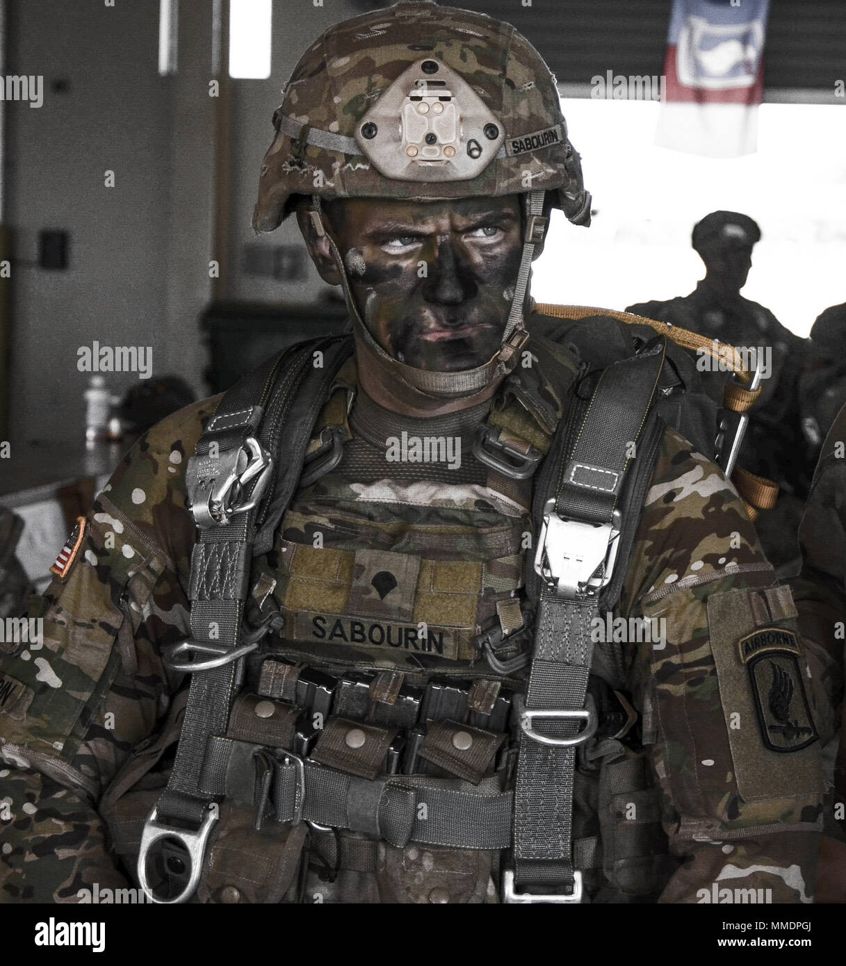 A paratrooper from the First Rock of the 173rd Airborne Brigade is ...