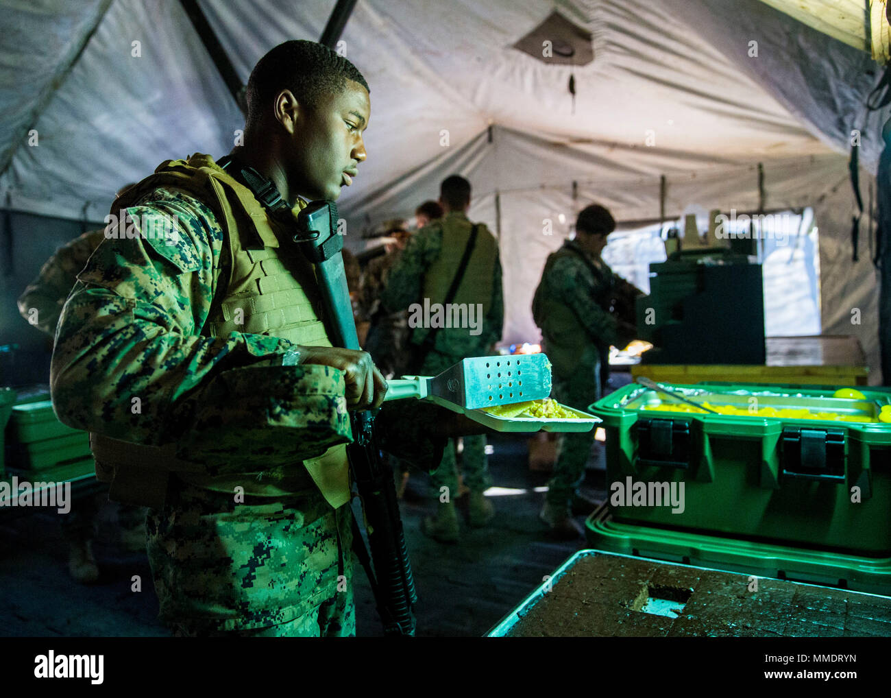 U.S. Marines eat at a field mess during Bold Alligator on Marine ...