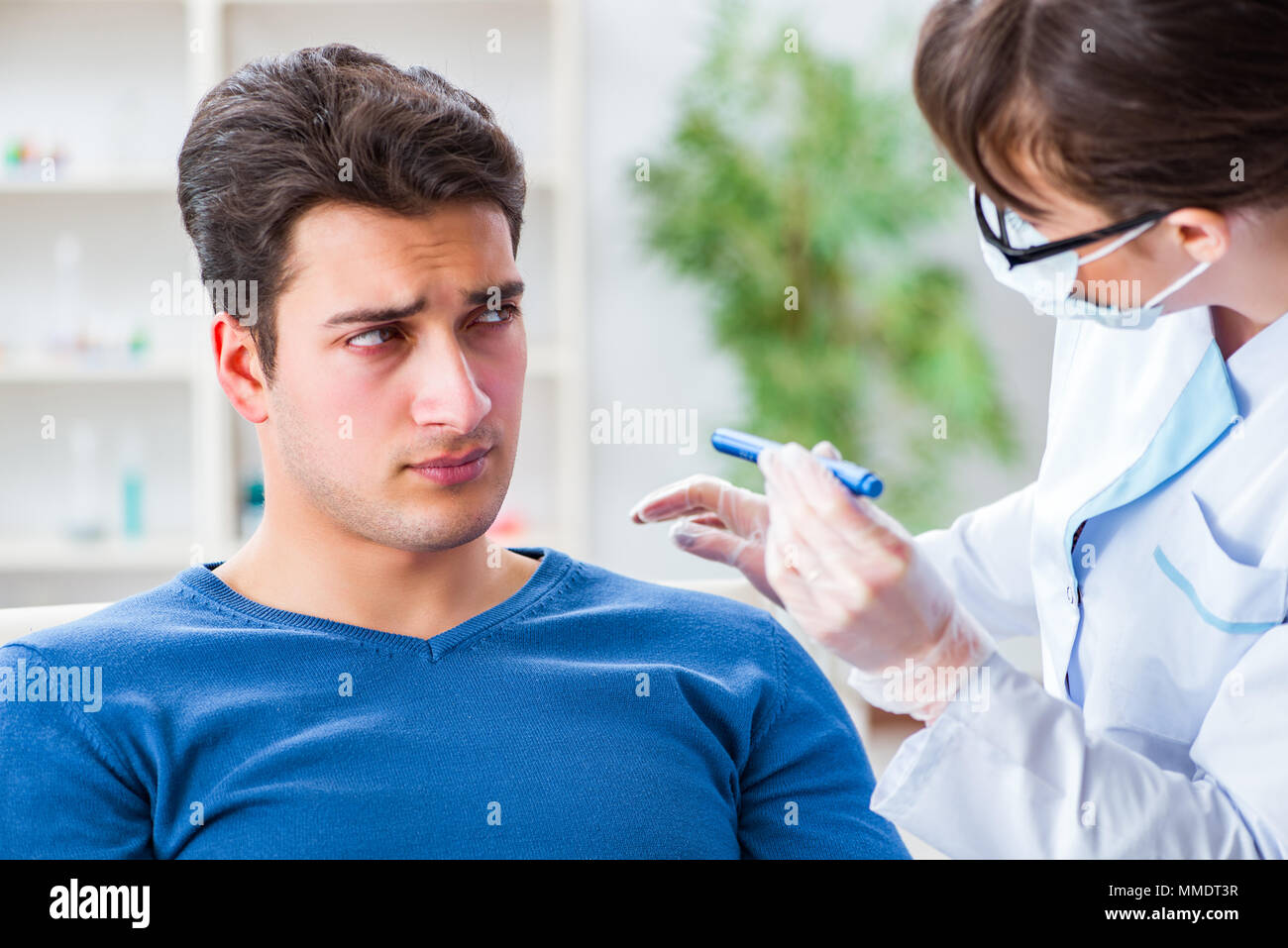 Doctor checking up patient in first aid concept Stock Photo - Alamy