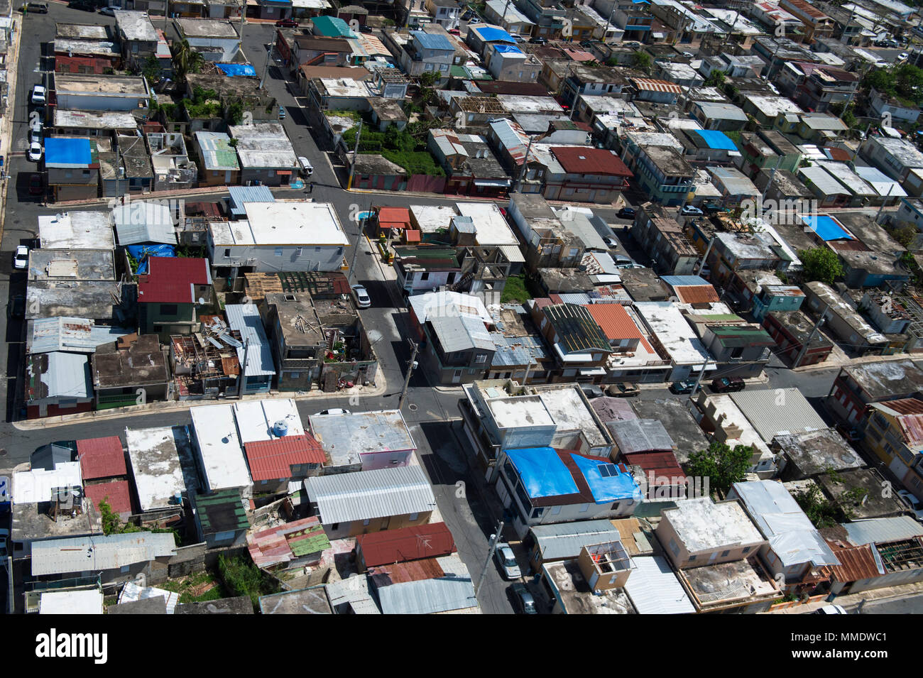 An aerial view of blue roofs on homes that the U.S. Army Corps of ...