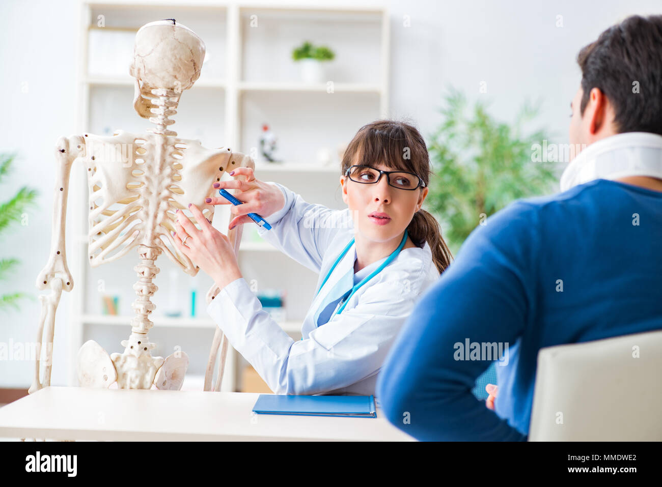 Doctor is explaining to patient with neck injury Stock Photo - Alamy