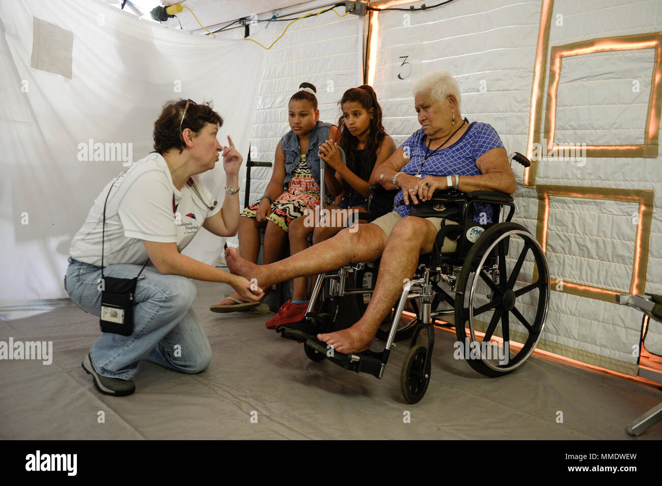 Celina Piñero Ramirez receives medical care from Maria Gbur, a medical ...