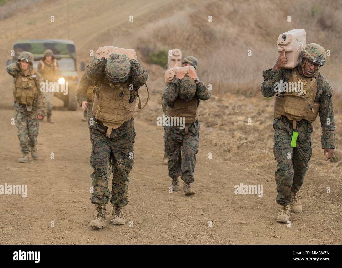 U.S. Marines hike up “First Sergeant’s Hill” during a squad event ...