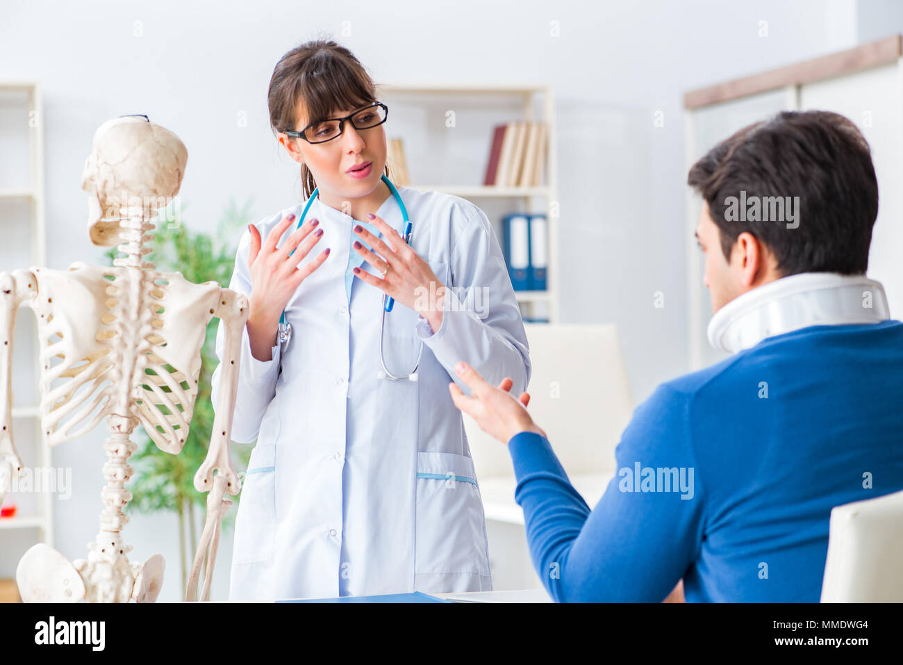 Doctor is explaining to patient with neck injury Stock Photo - Alamy