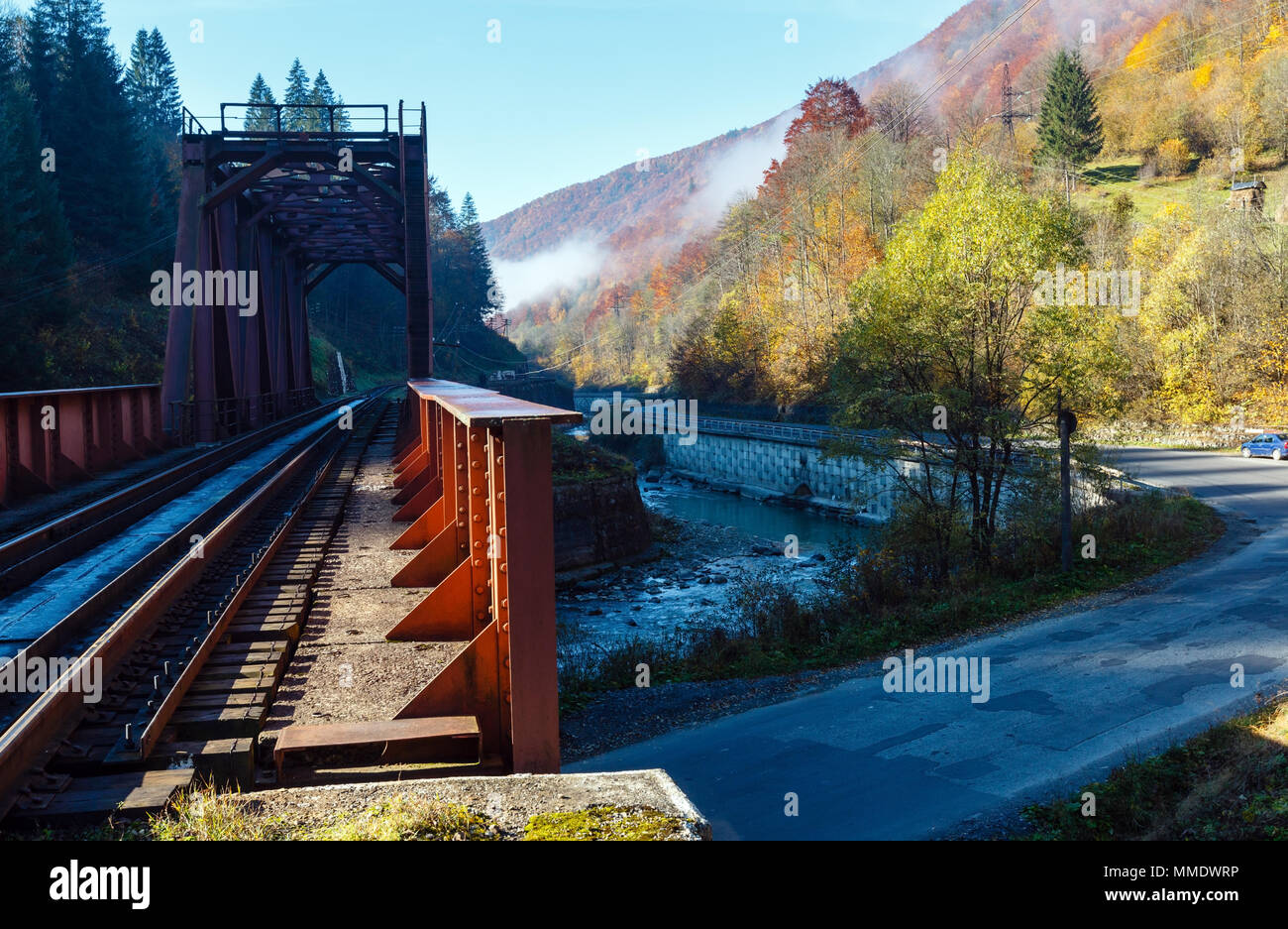 Autumn Carpathian Mountains misty landscape with railroad bridge ...