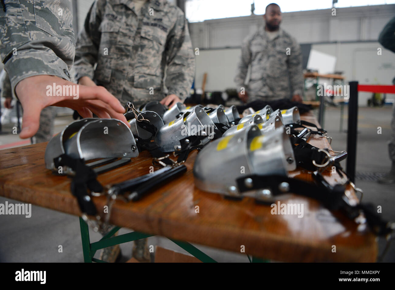 Lt. Col. Ryan Crowley, 52nd Civil Engineer Squadron commander, reaches ...