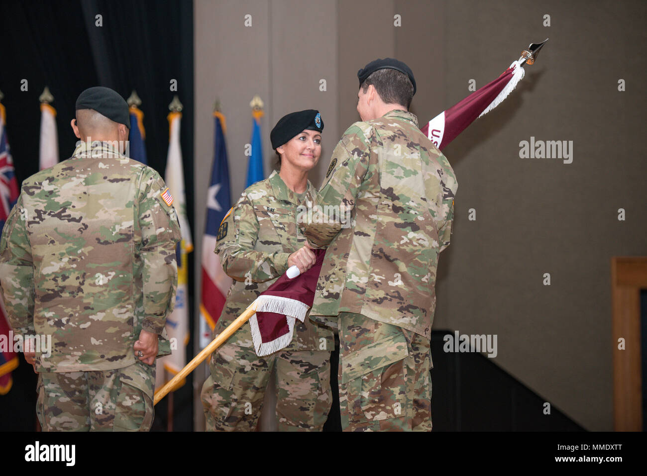 CSM Janell Ray hands the battalion flag to COL Kevin Bass during the ...