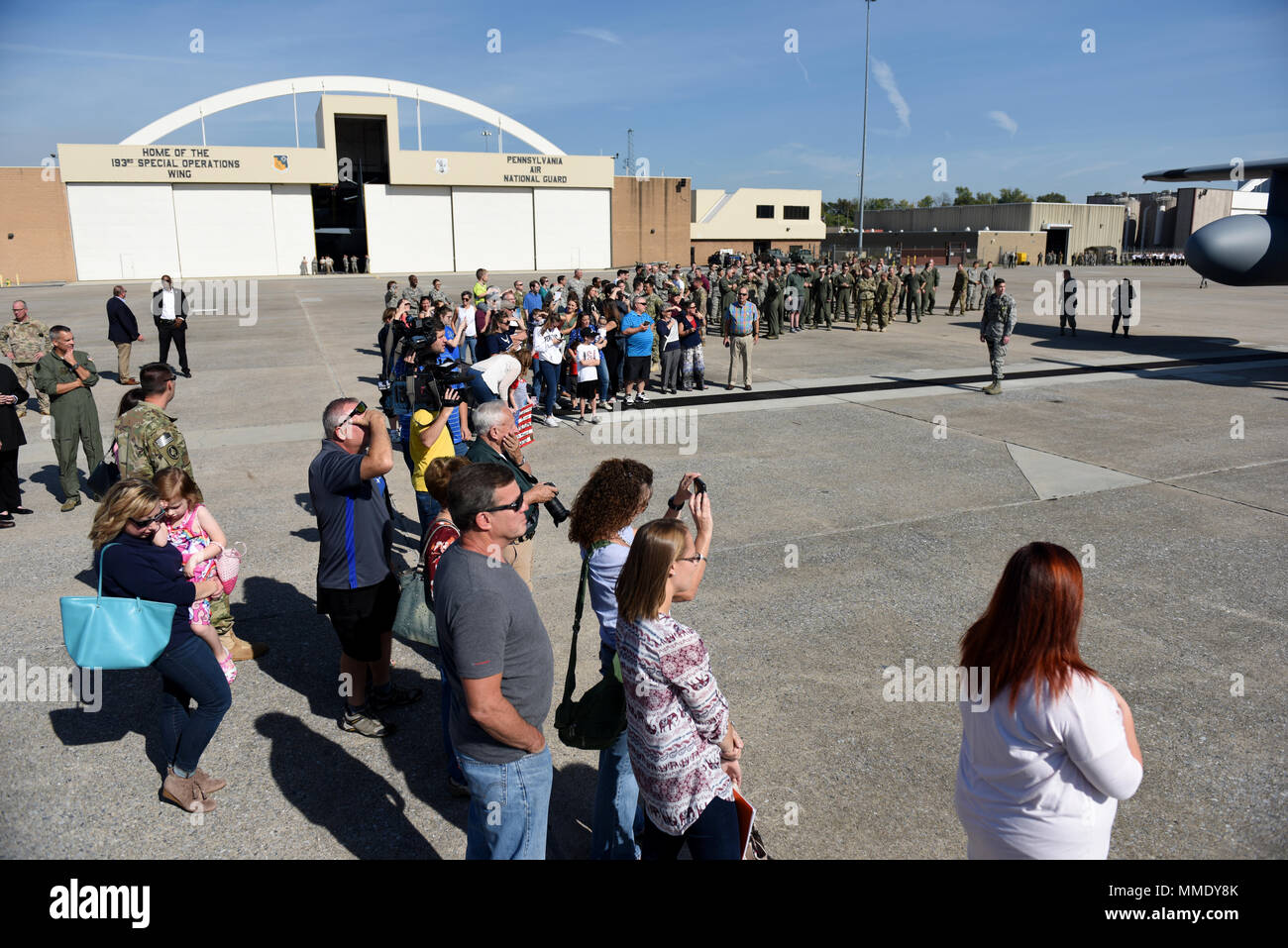 Friends and family of the 193rd Special Operations Wing wait on the ...