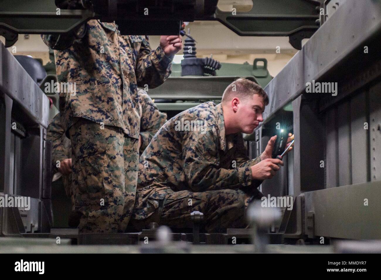 PACIFIC OCEAN (Oct. 23, 2017) Marines conduct maintenance on the bed of ...