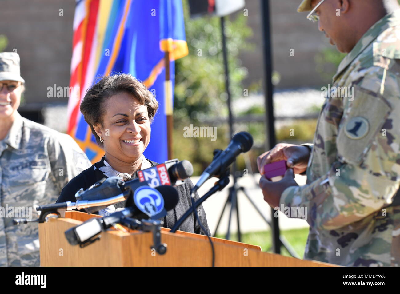 Brigadier General David Fleming presents a gift to his wife Andrea at ...