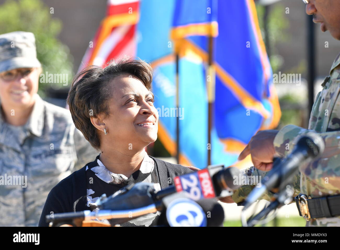 Brigadier General David Fleming presents a gift to his wife Andrea at ...